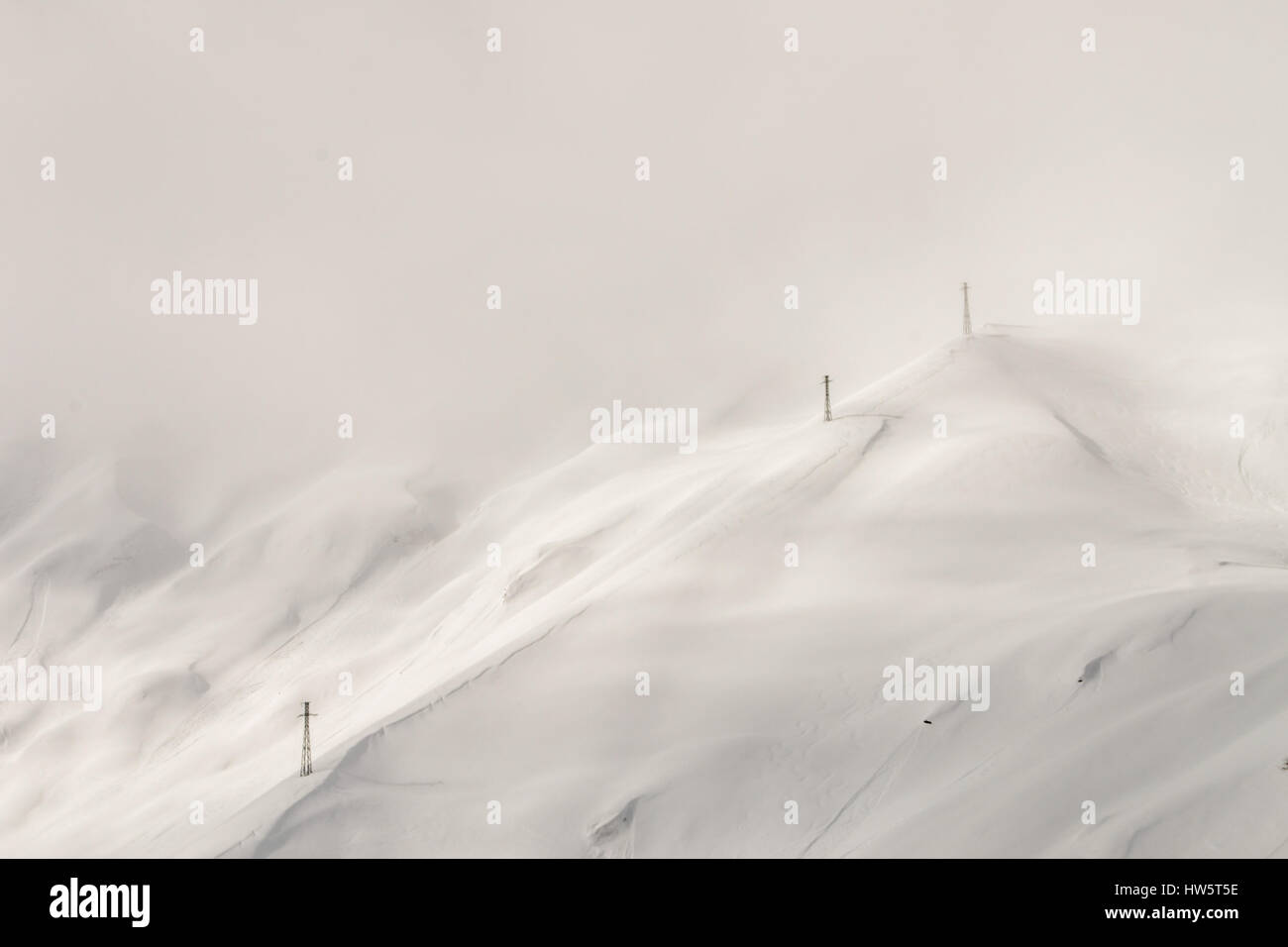 White. Snowy hillside of Mont Blanc, Italy, between low clouds Stock ...