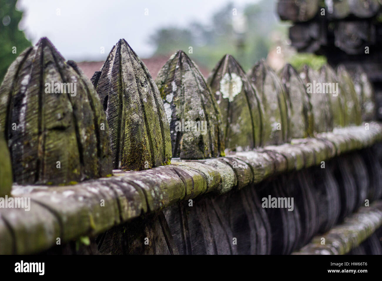 Ancient Protective wooden fence of sharp logs standing together. Bali ...