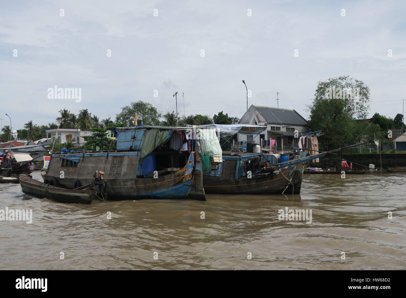 Mekong river in Indochina, simply wooden boat on dirty river with ...