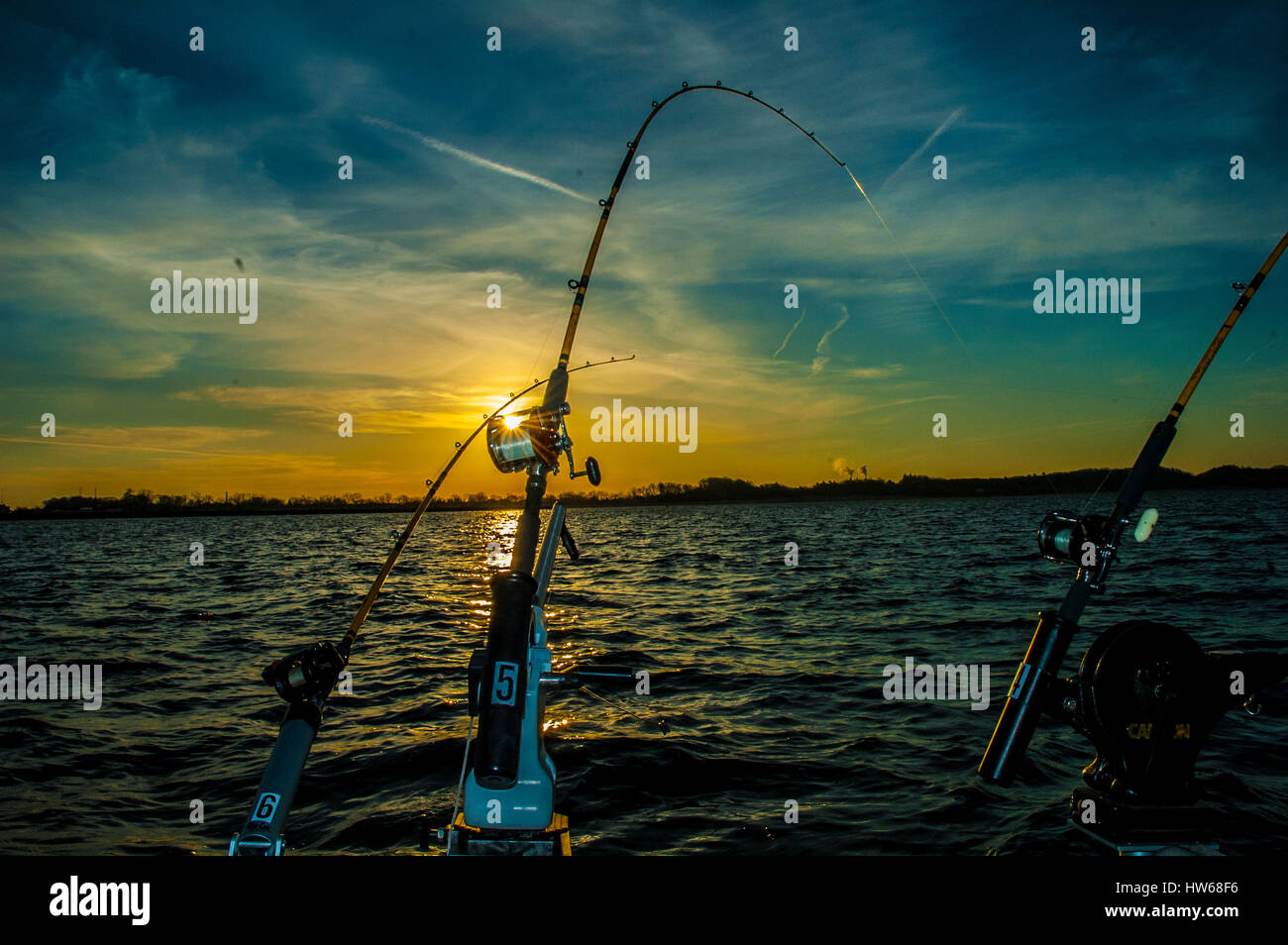 sunrise fishing from boat Stock Photo - Alamy
