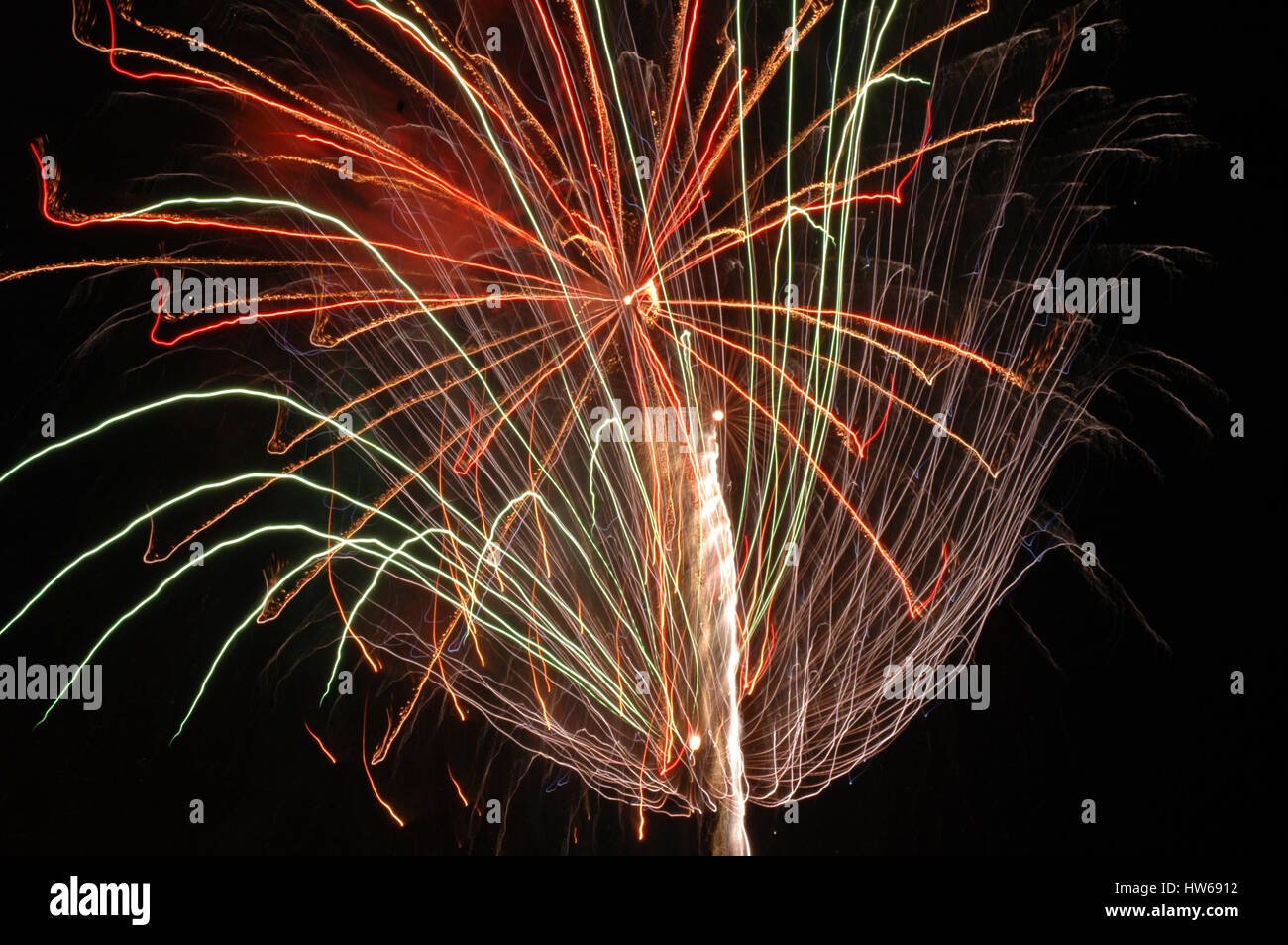 exploding fireworks in sky background Stock Photo - Alamy