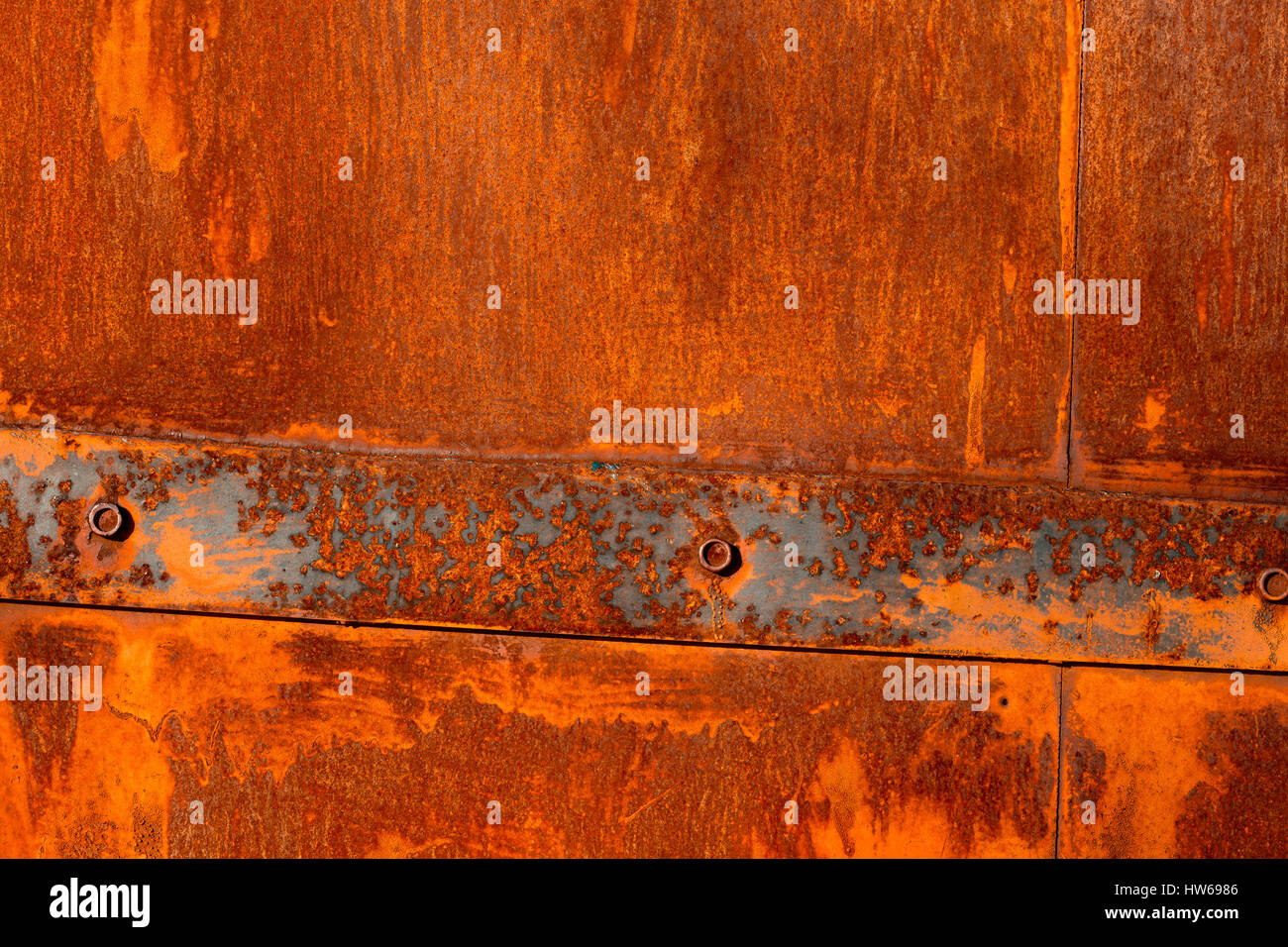 Colored rusty stained metal wall texture pattern Stock Photo - Alamy