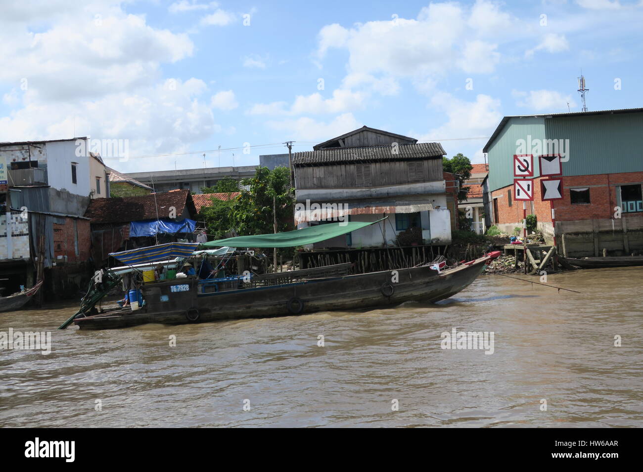 Mekong river in Indochina, simply wooden boat on dirty river with ...