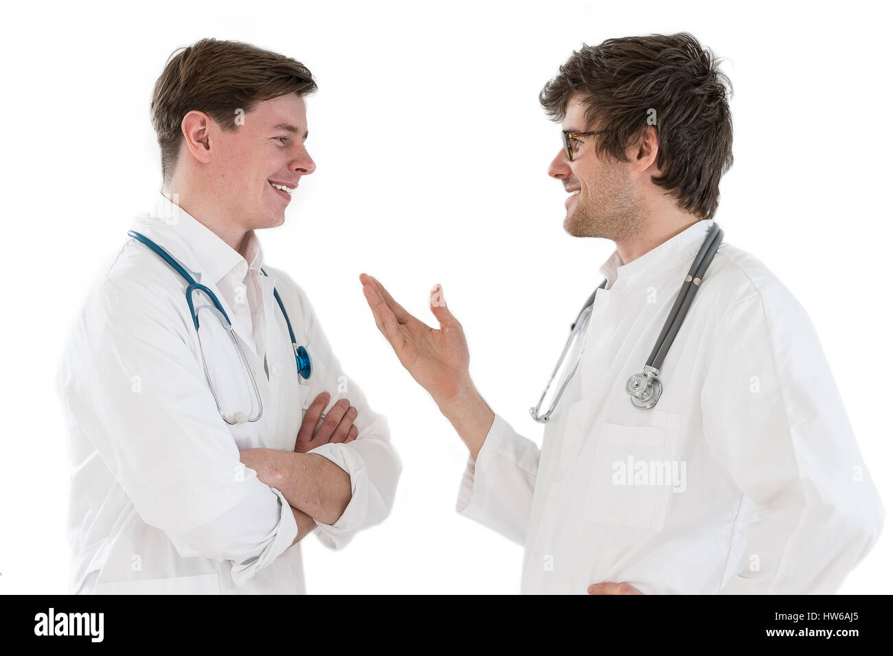 Two doctors men having conversation on a white background Stock Photo ...