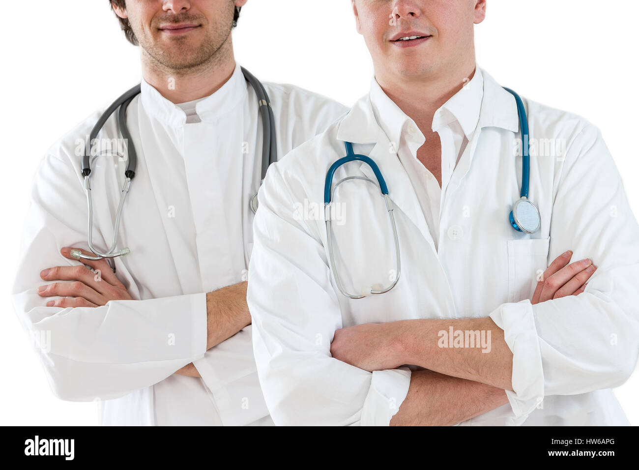 happy young men doctor smiling with arms crossed Stock Photo - Alamy