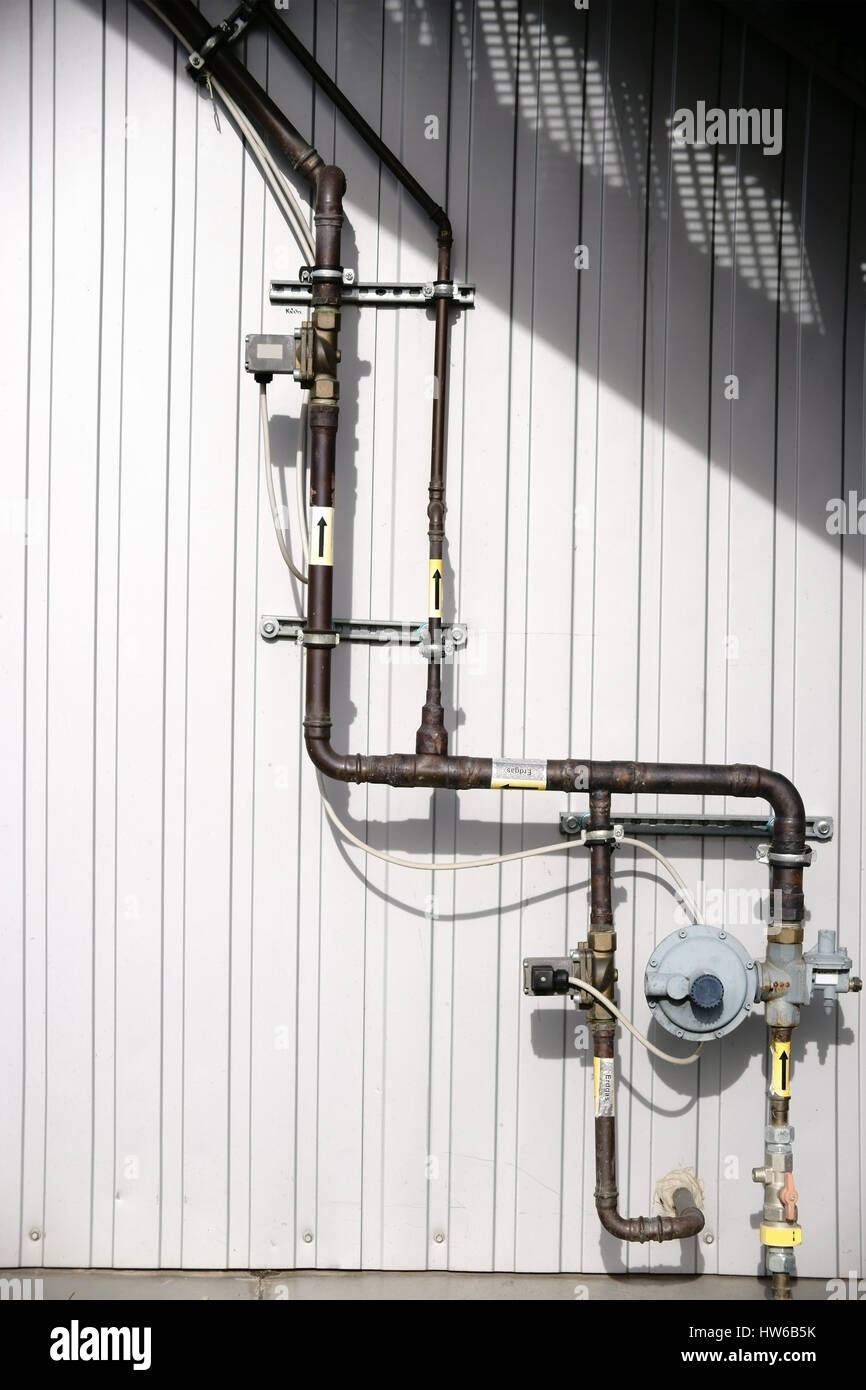 A gas pipe of copper with various valves and control modules on the ...