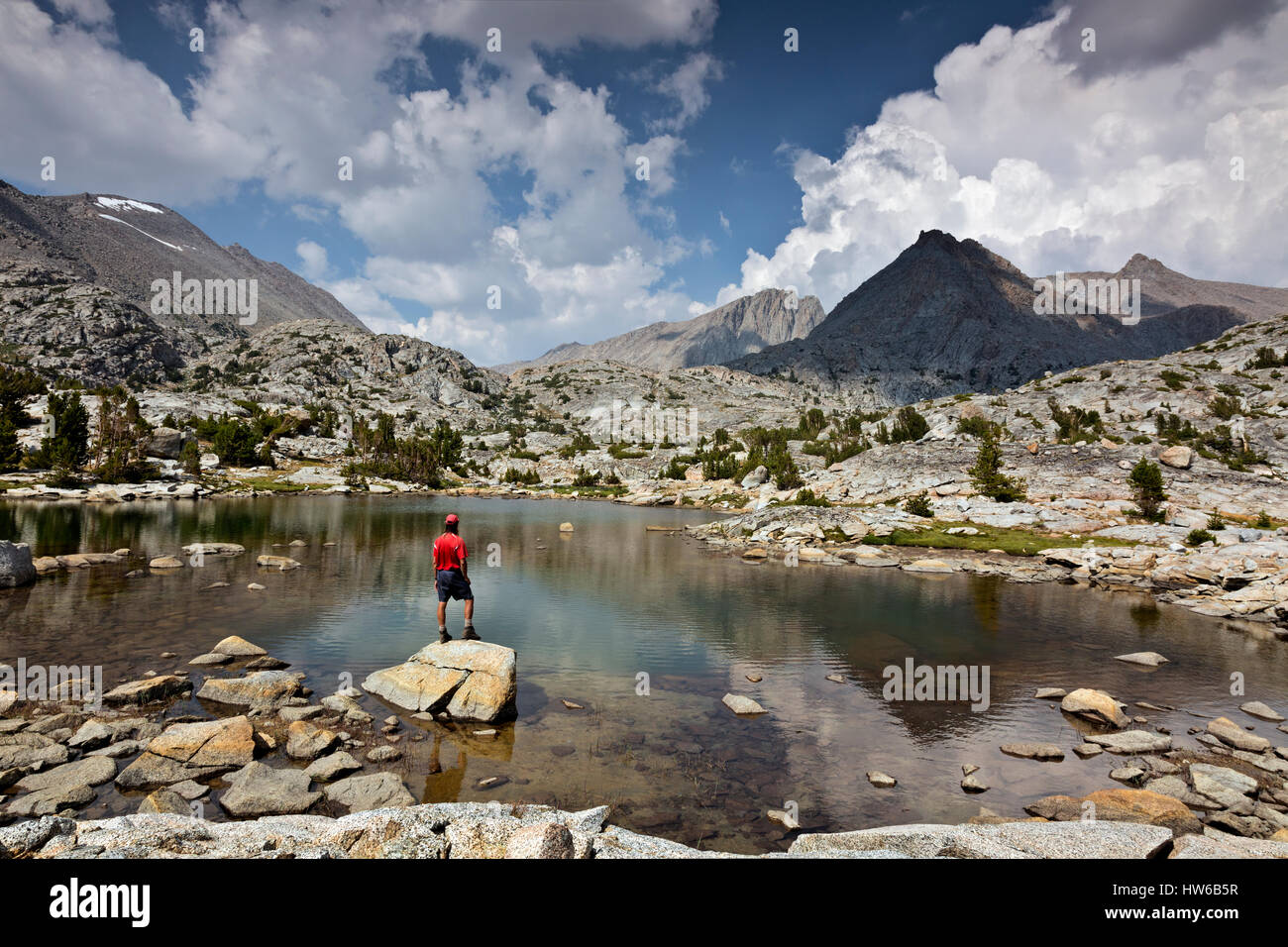 CA03099-00...CALIFORNIA - Hiker a tarn on Darwin's Bench in the Kings ...