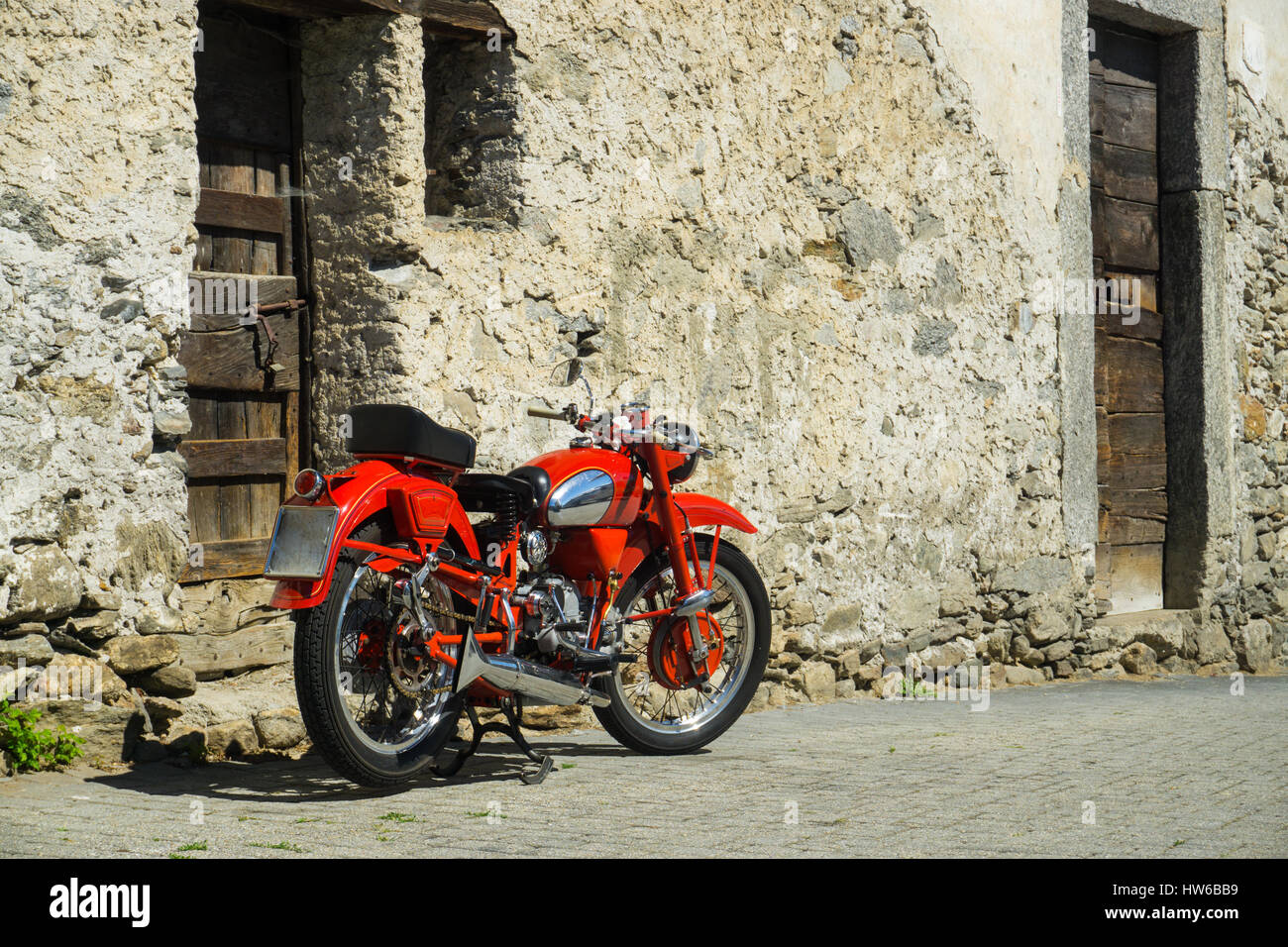 Red bike parked on the street of old town in Italy Stock Photo - Alamy