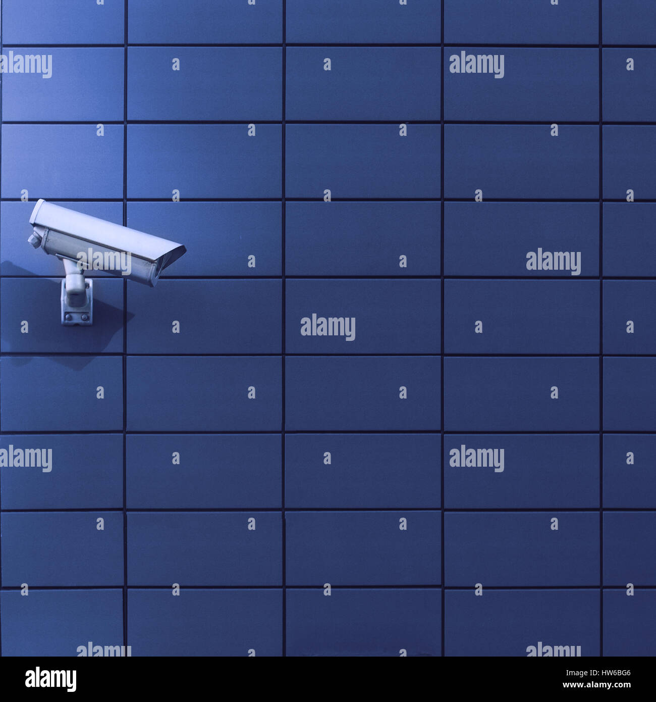 Horizontal front view of a surveillance monitoring white camera viewed ...