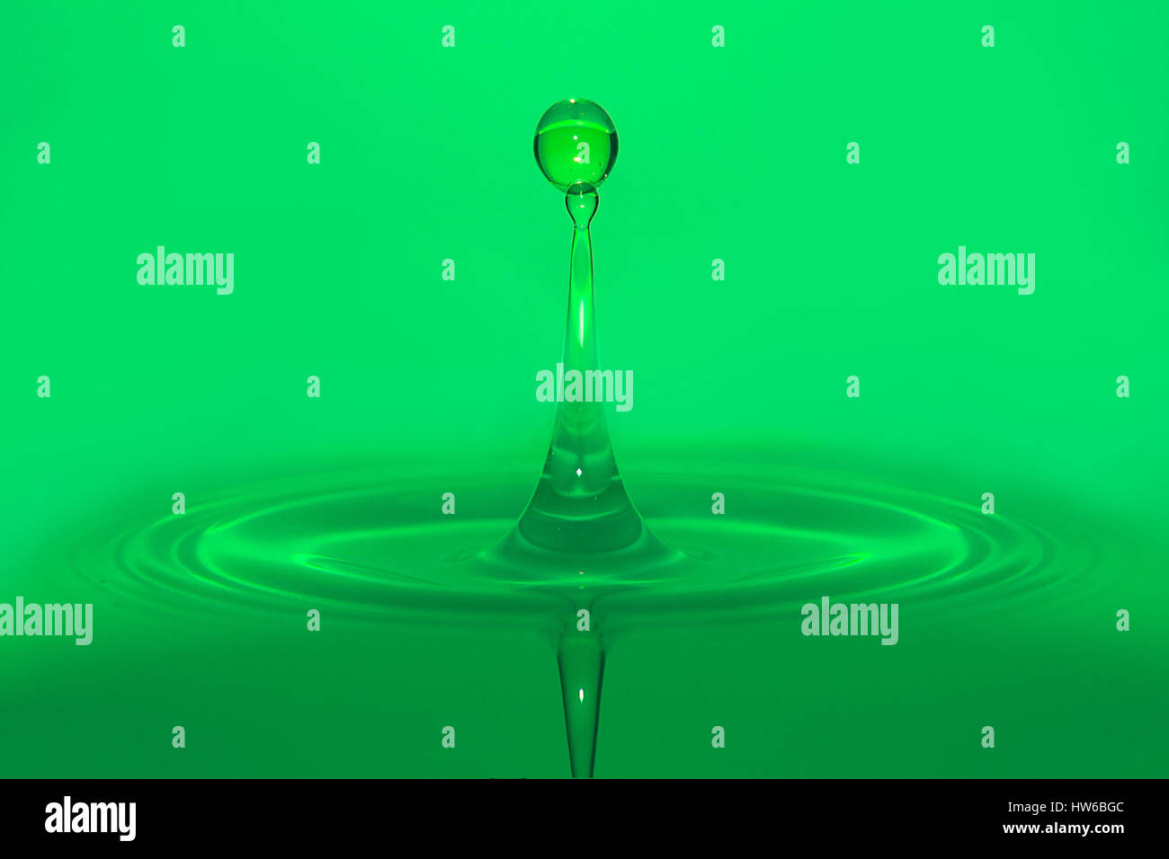 high speed Green water drop splashing Stock Photo - Alamy