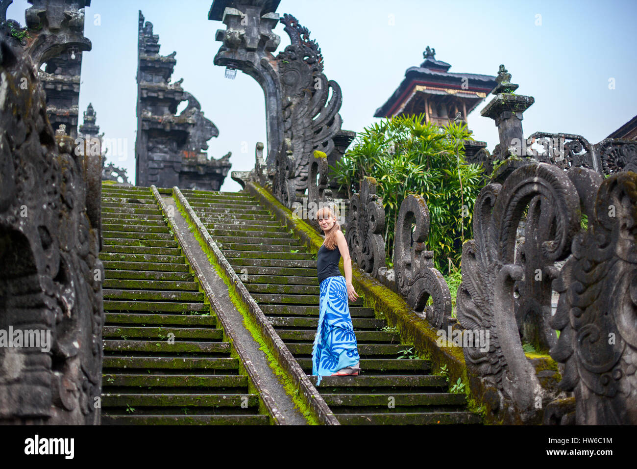 A young woman climbs the ancient steps to the Buddhist temple Stock ...