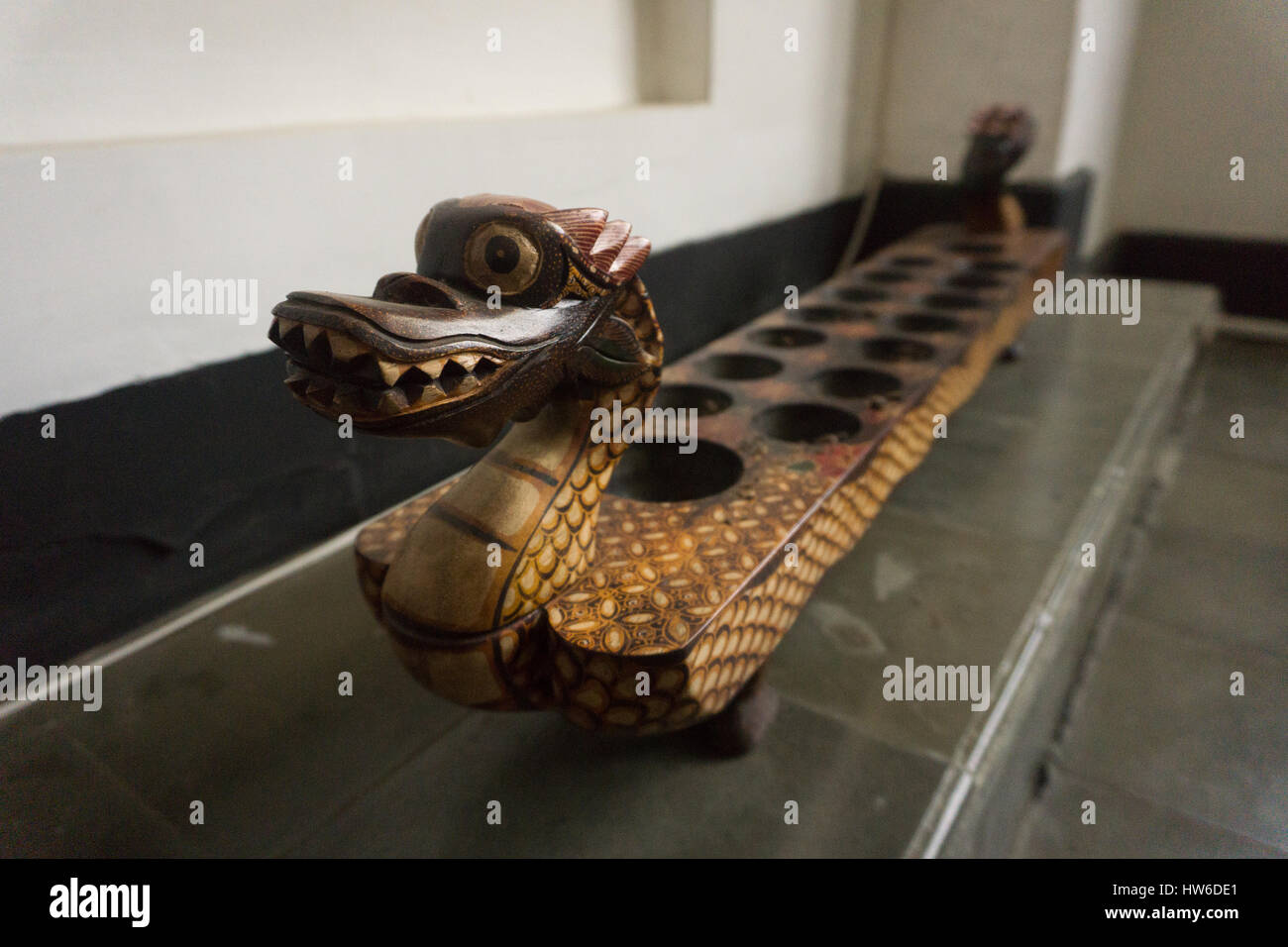 Congklak as one of traditional game made from wood with dragon head ...