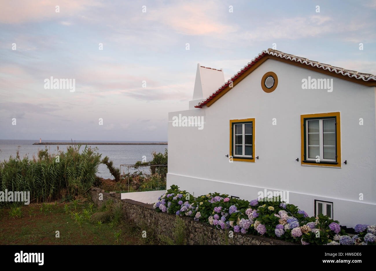 Traditional stone house in green landscape of Azores island Stock Photo ...