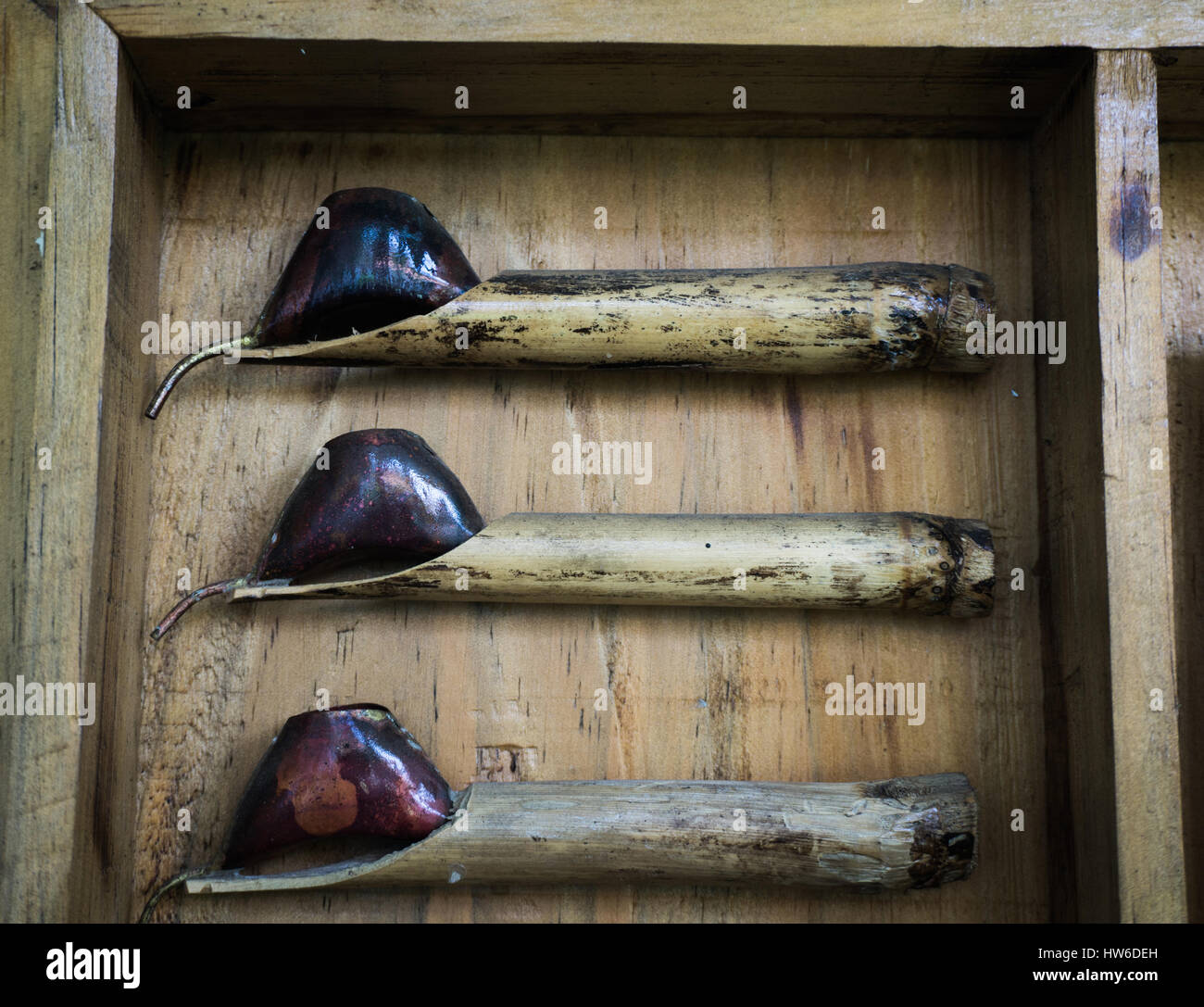 Bamboo canting filling with hot wax for drawing Batik pattern displayed ...