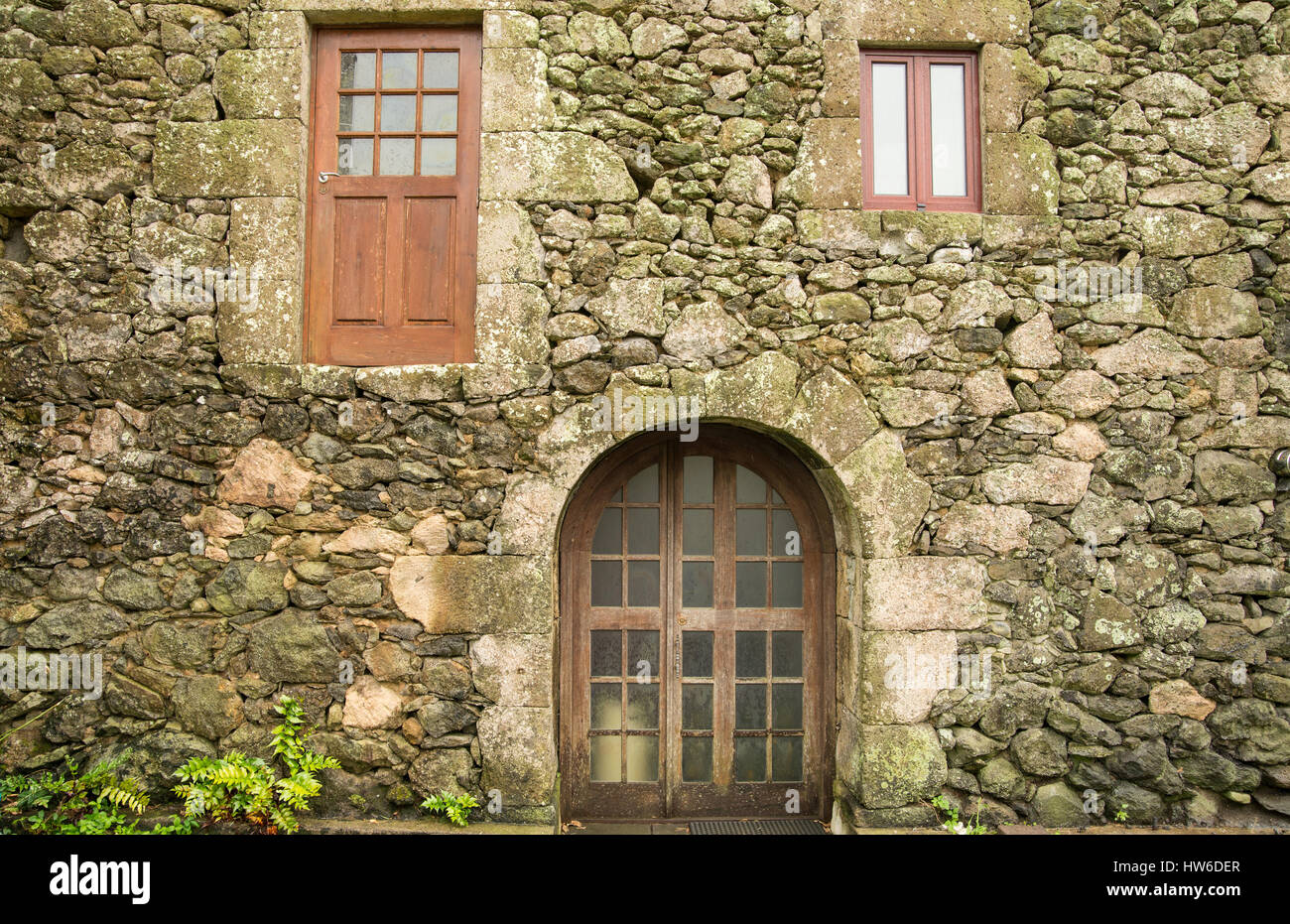 Traditional stone house in green landscape of Azores island Stock Photo ...