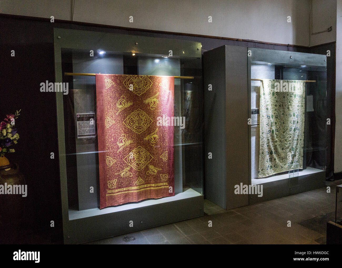 Batik fabric collection displayed in glass cabinet with lighting photo ...