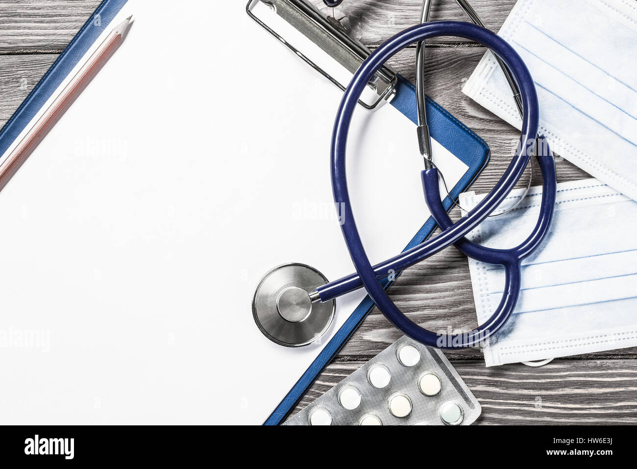 Desk of doctor with medicine things Stock Photo - Alamy