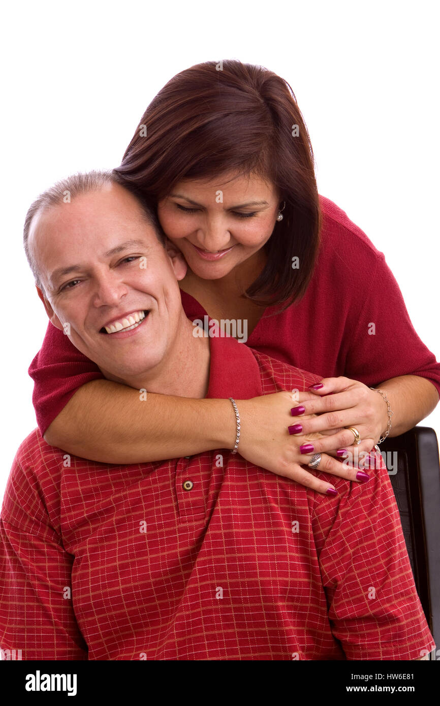Hispanic couple hugging isolated on white Stock Photo - Alamy