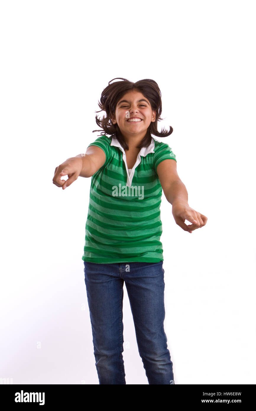Happy young girl smiling and dancing Stock Photo - Alamy