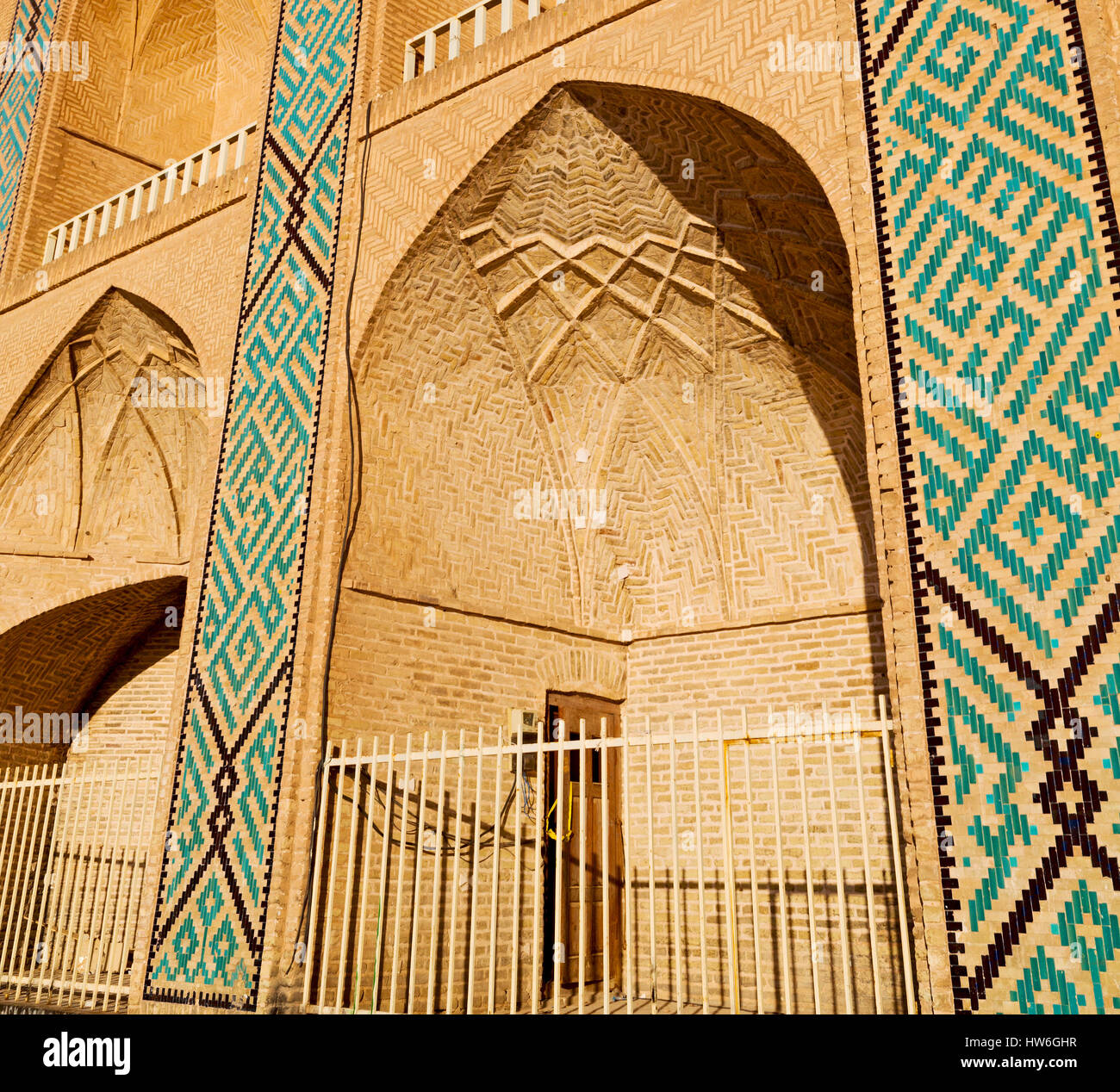 in iran the old mosque and traditional wall tile incision near minaret ...