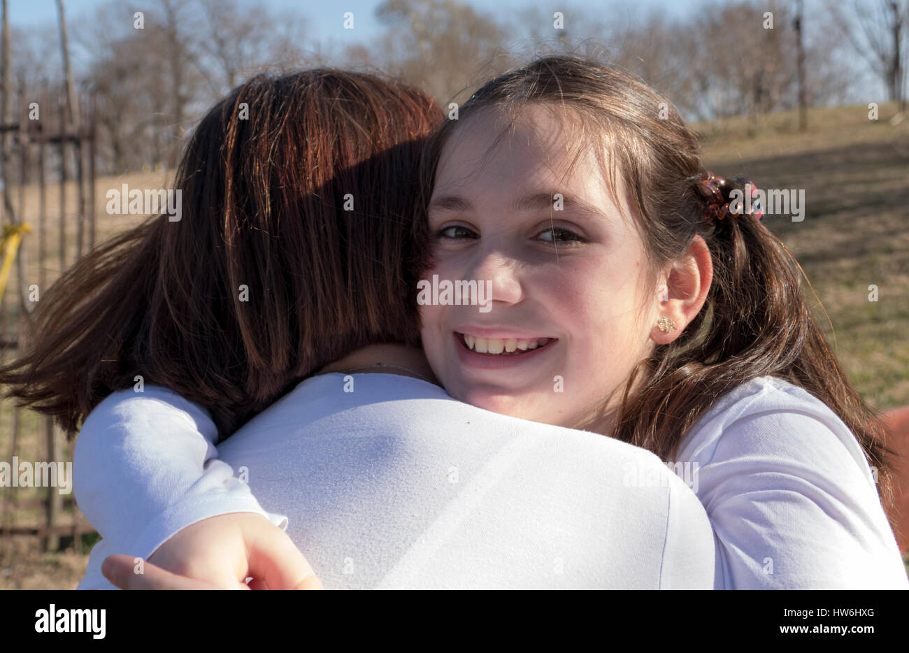 Mother and Daughter hugging in park during the sunny spring day Stock Photo - Alamy