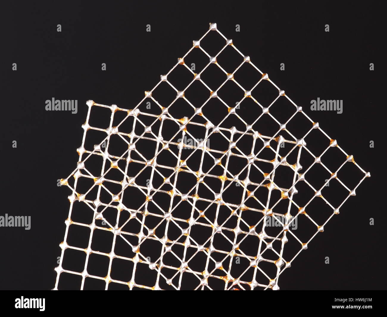 Two tin wire grids with practice solder joints on every intersection ...