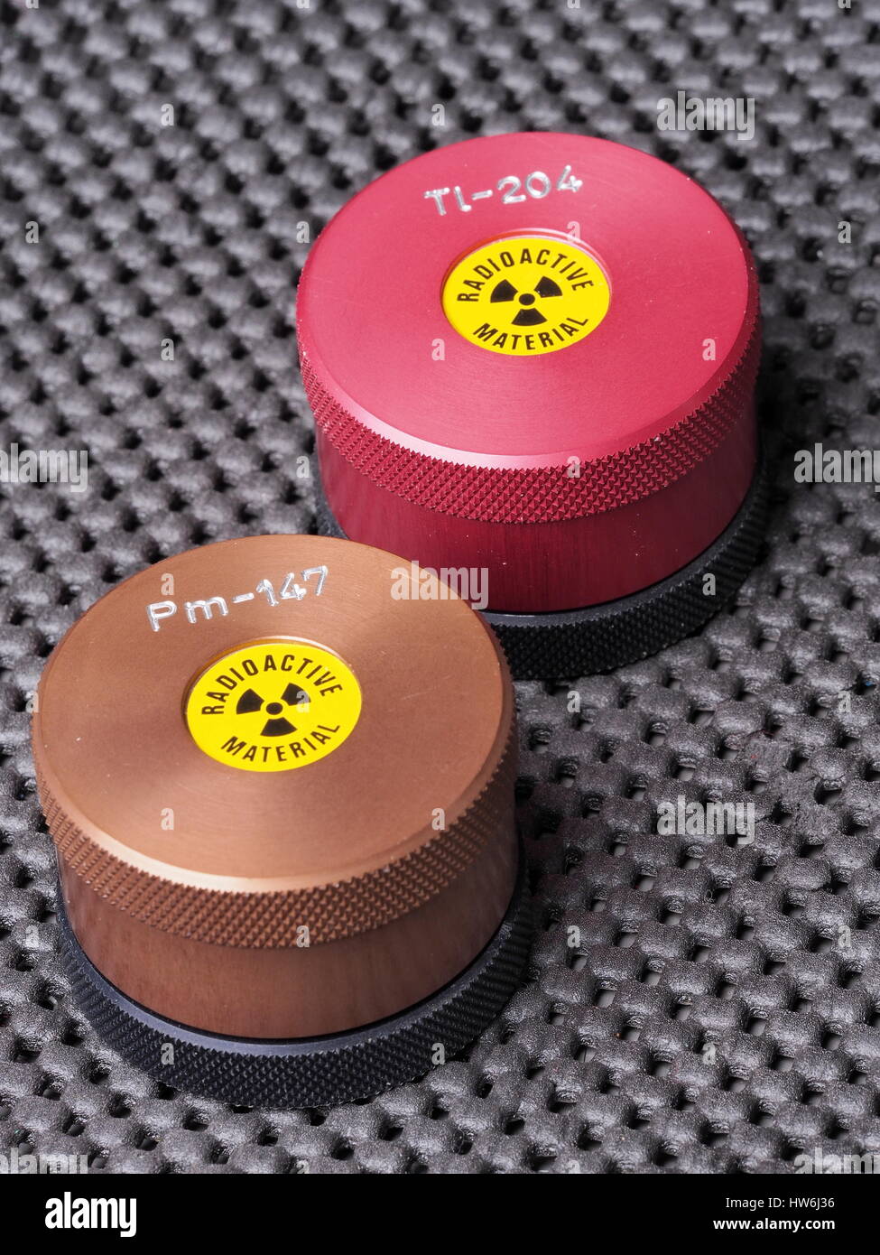 Two specialist containers with warning sticker and engraving containing ...