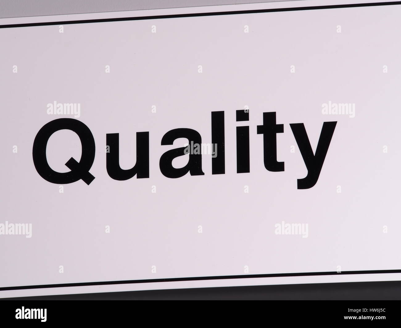 Quality wall sign in black on off white background on a wall, Australia ...