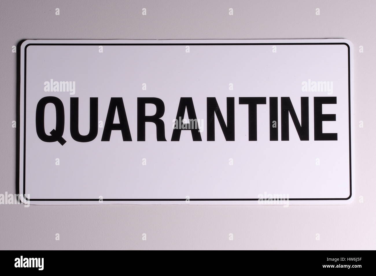 Quarantine wall sign in black on off white background on a wall ...