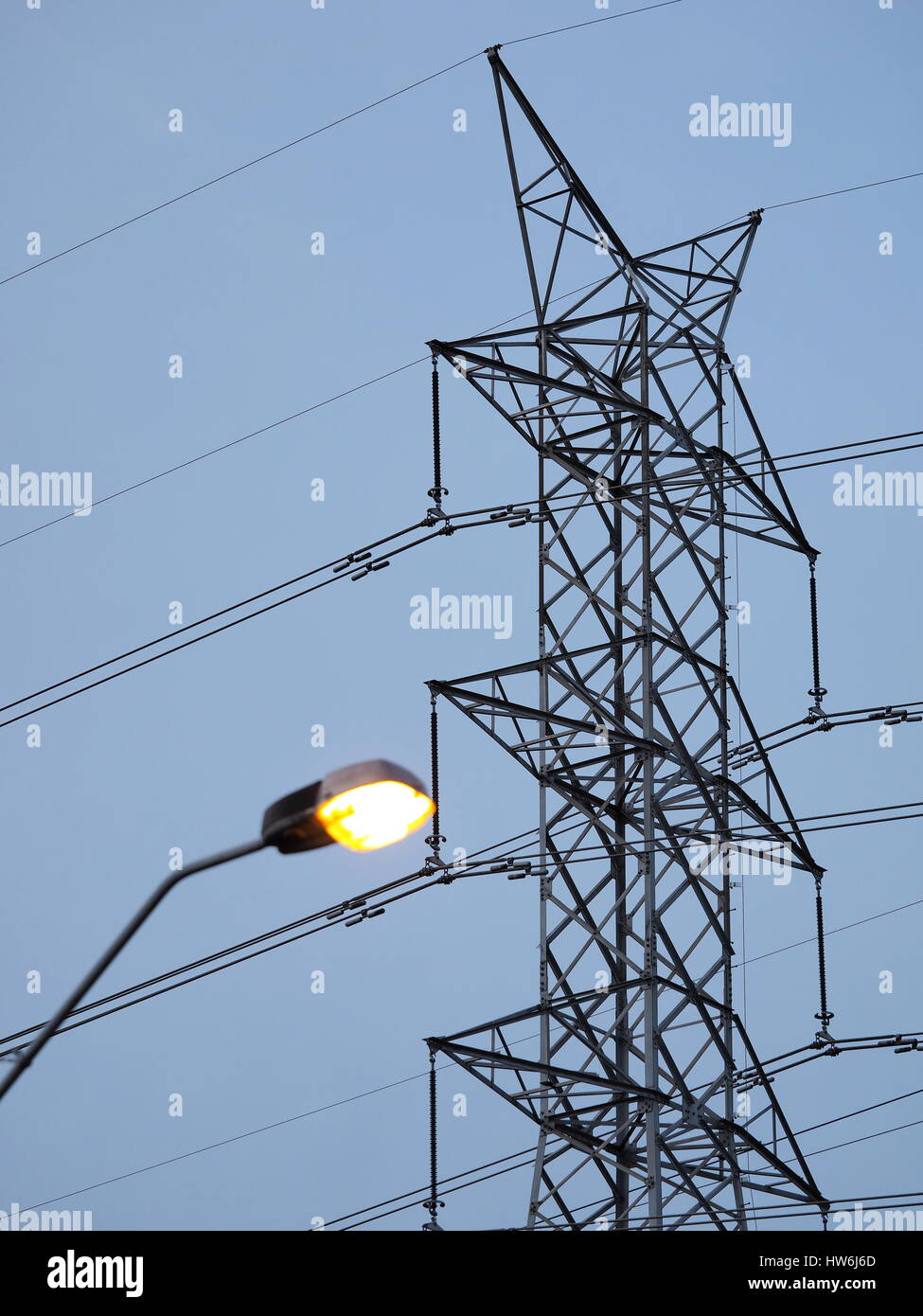 Street light and background power line tower under clouds, Melbourne ...