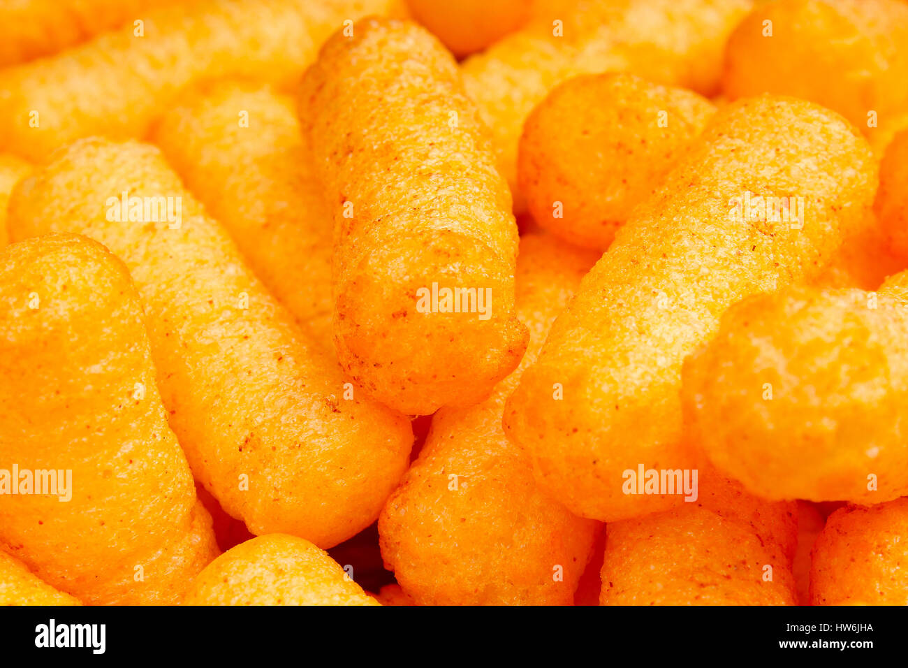 Cheese puff texture Stock Photo - Alamy