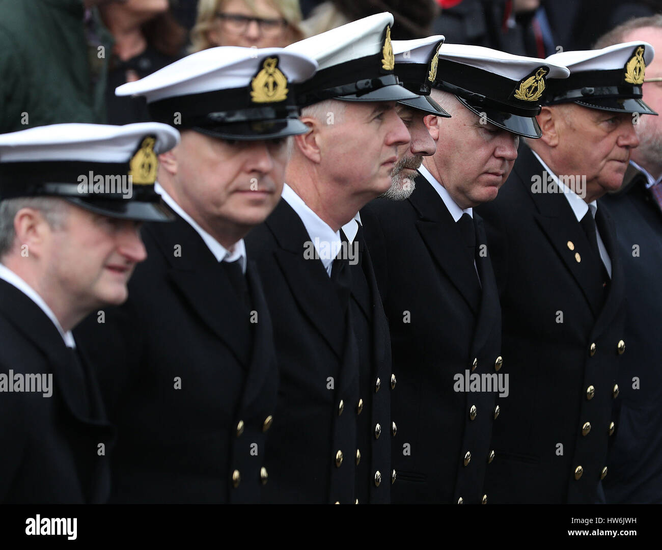 Members of the Coast Guard await the arrival of the coffin for the ...