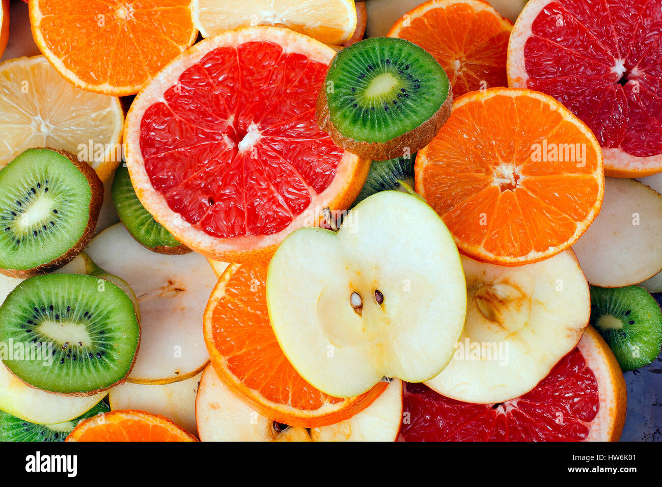 Fruits. Half fruits as background Stock Photo - Alamy