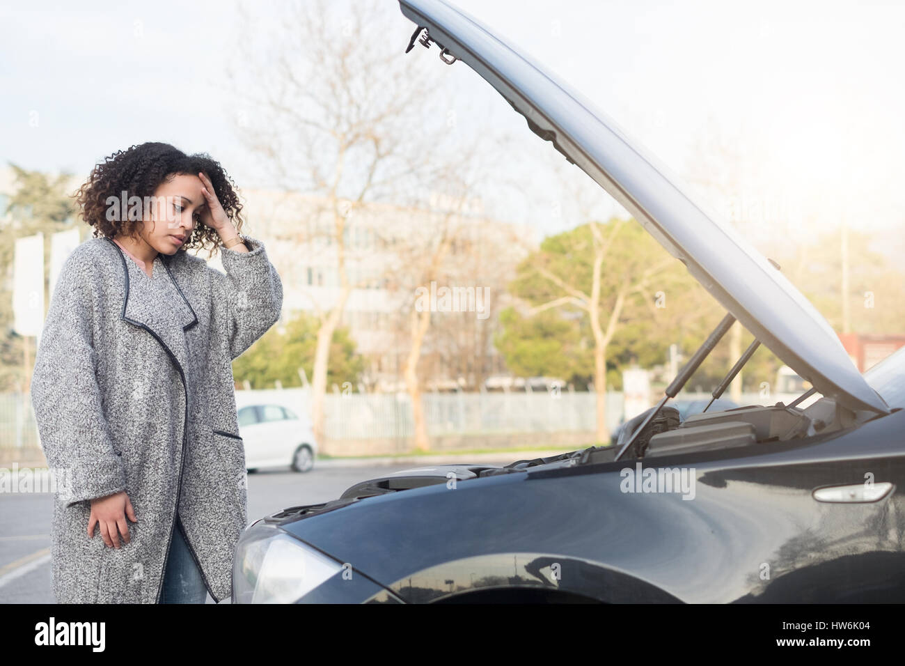 Woman fixing car hi-res stock photography and images - Alamy