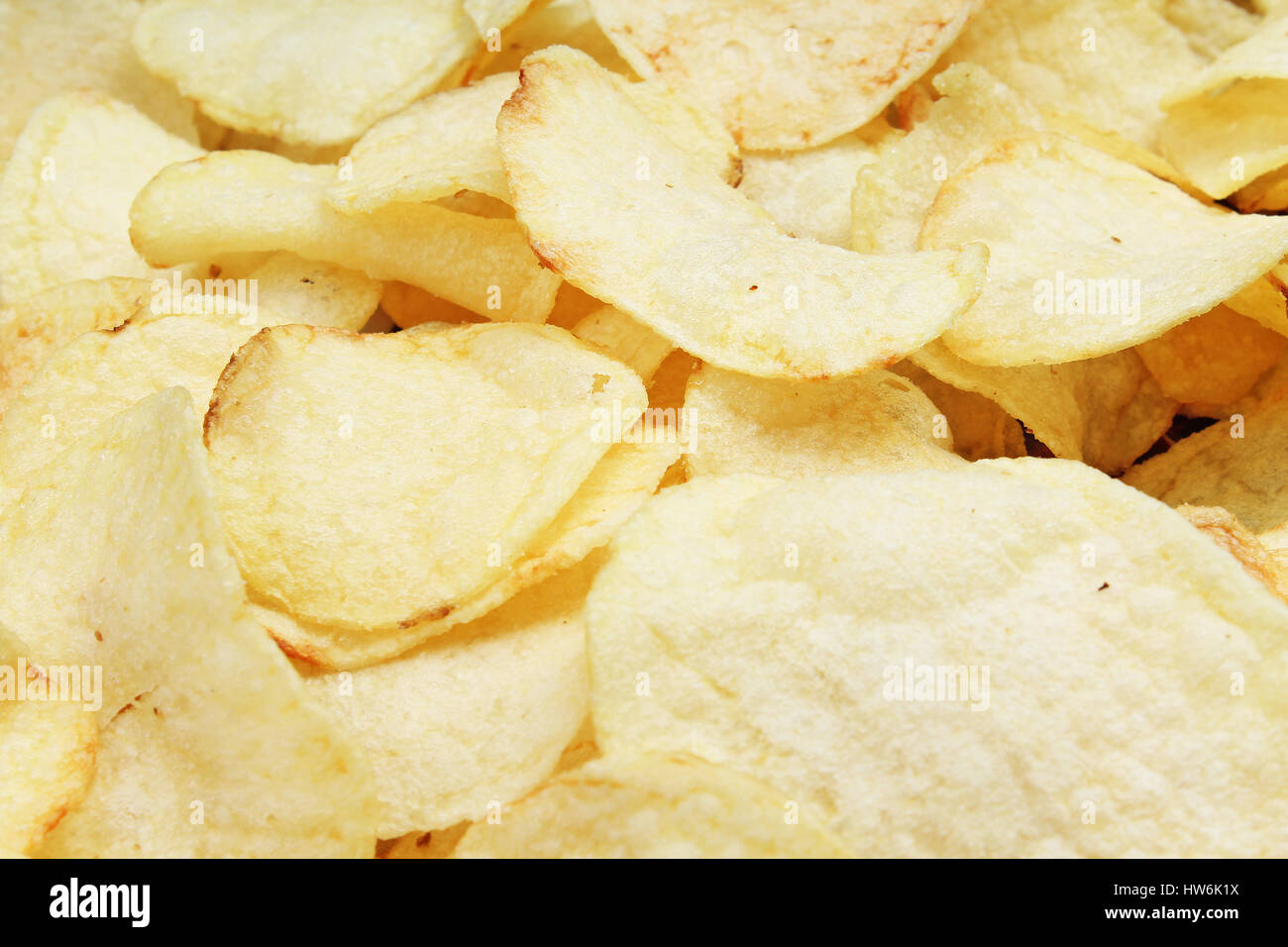 Potato chips texture background Stock Photo - Alamy