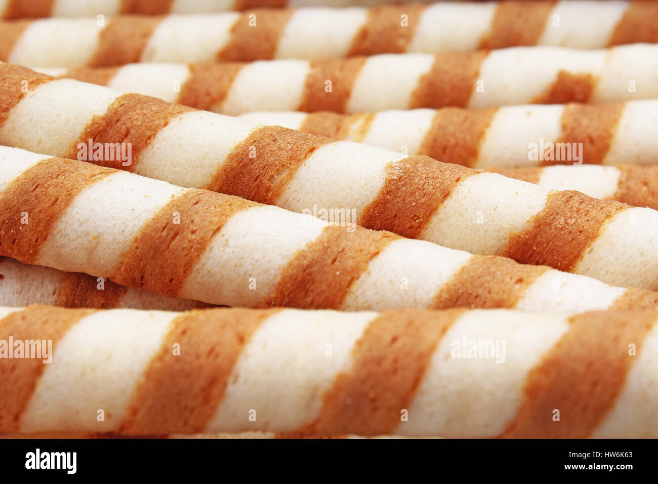 Ice cream wafer sticks. Curled wafer curls as background Stock Photo ...