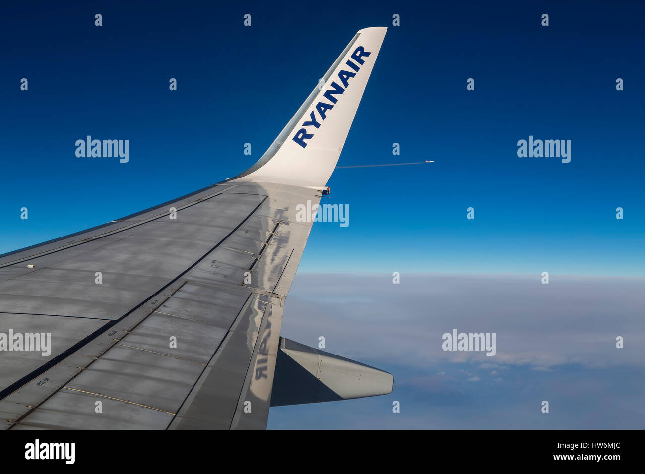 View of airplane wing through window Stock Photo - Alamy