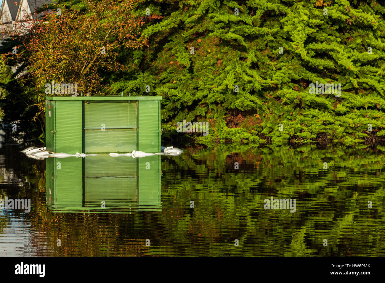 One green power box with flood waters around it Stock Photo - Alamy