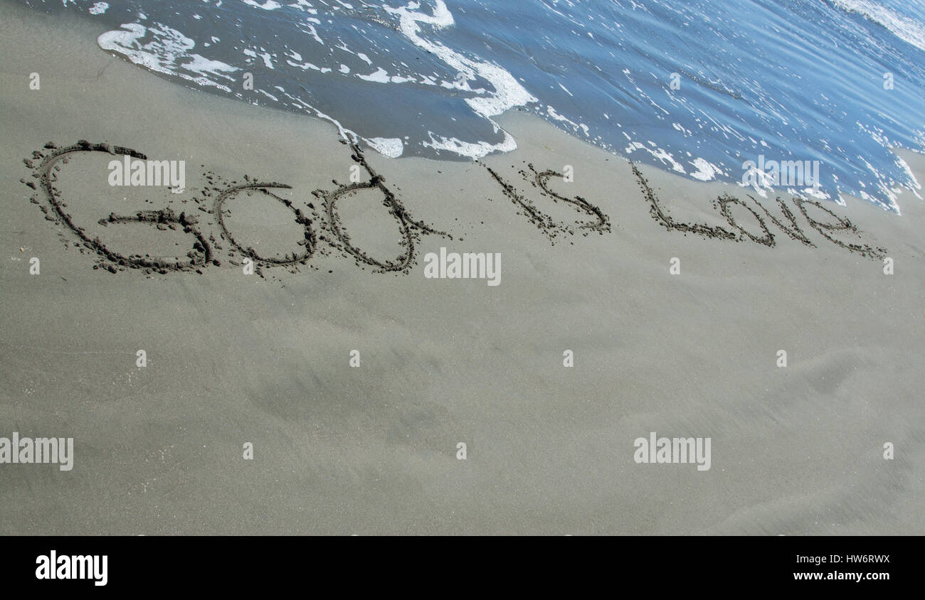 Faith written in sand hi-res stock photography and images - Alamy
