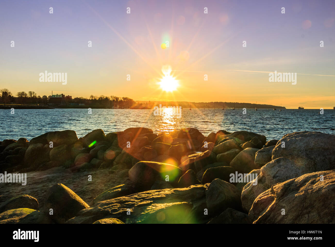 Rock Beach Sunset Stock Photo - Alamy