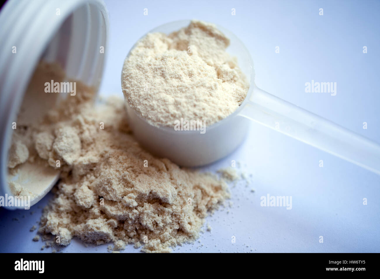 Vanilla protein powder in scoop on white background Stock Photo - Alamy