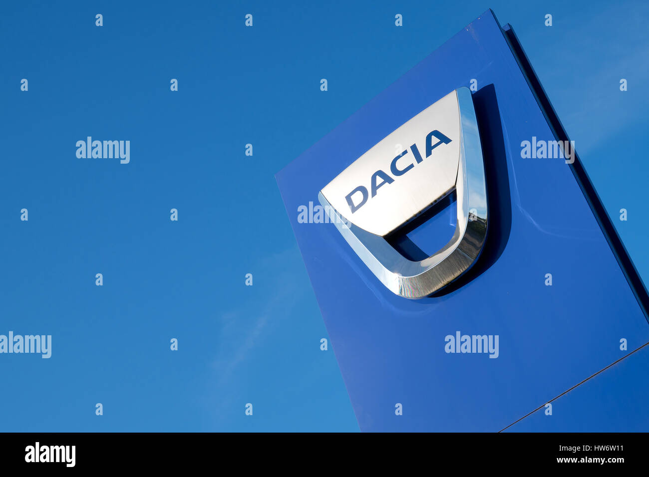 Dacia dealership sign against blue sky Stock Photo - Alamy