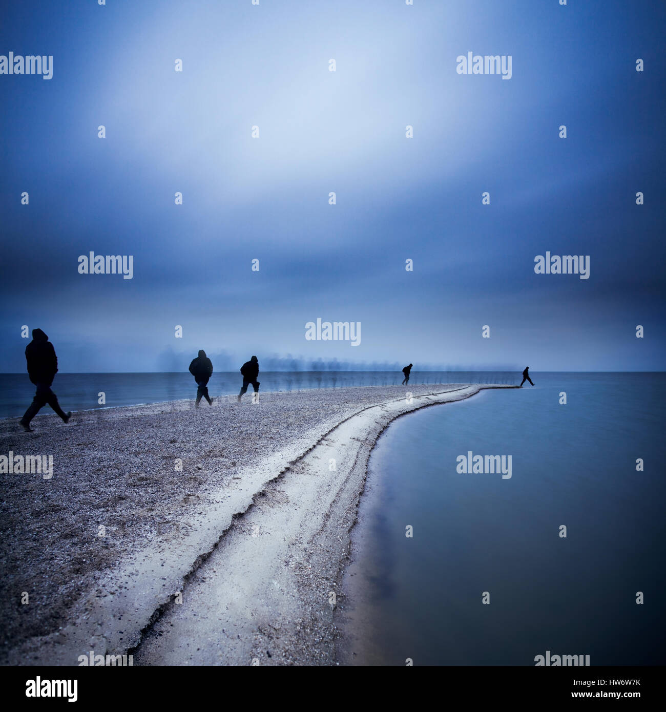 the man walking on a braid in the sea. long exposition. the lone Stock ...