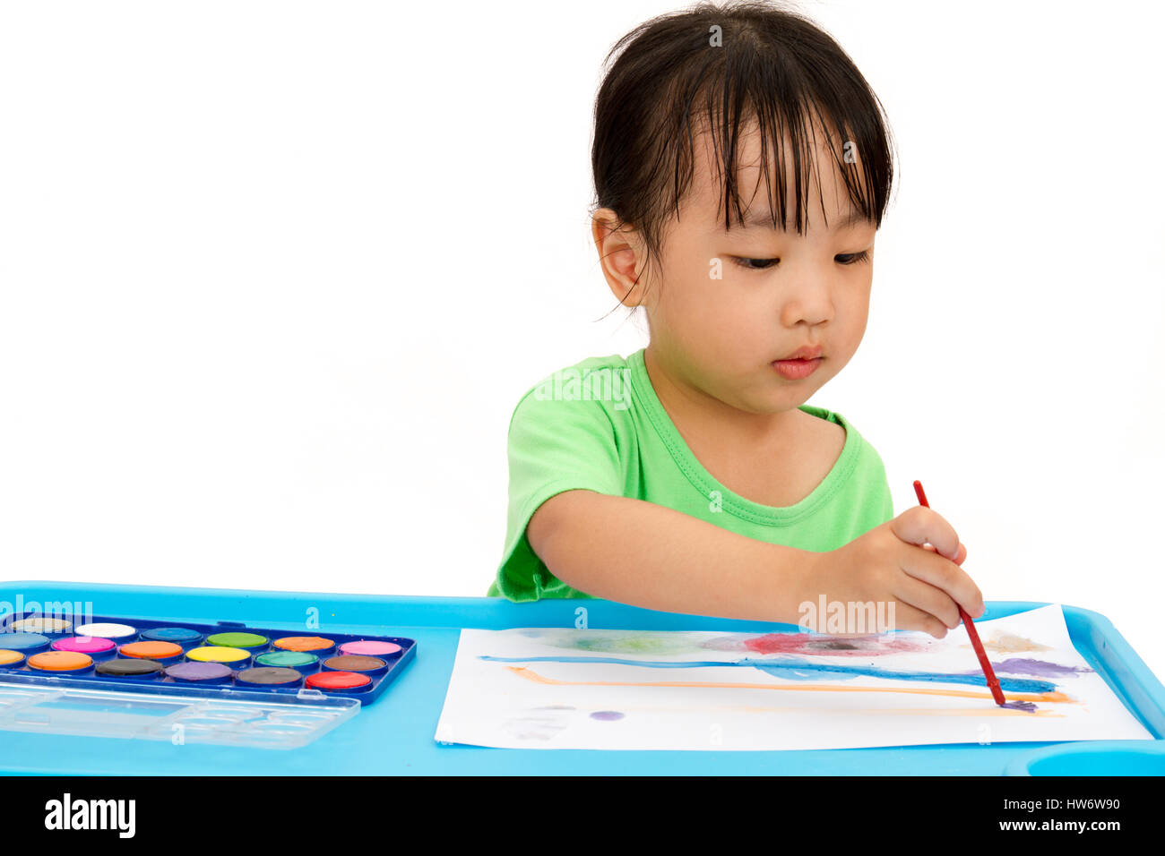 Asian Little Chinese Girl Painting with Brush at Home Stock Photo - Alamy
