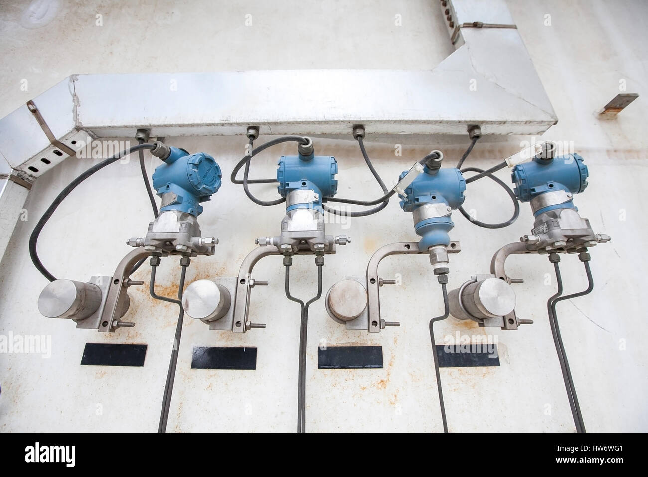 Industrial zone, pipes valve connection Stock Photo - Alamy