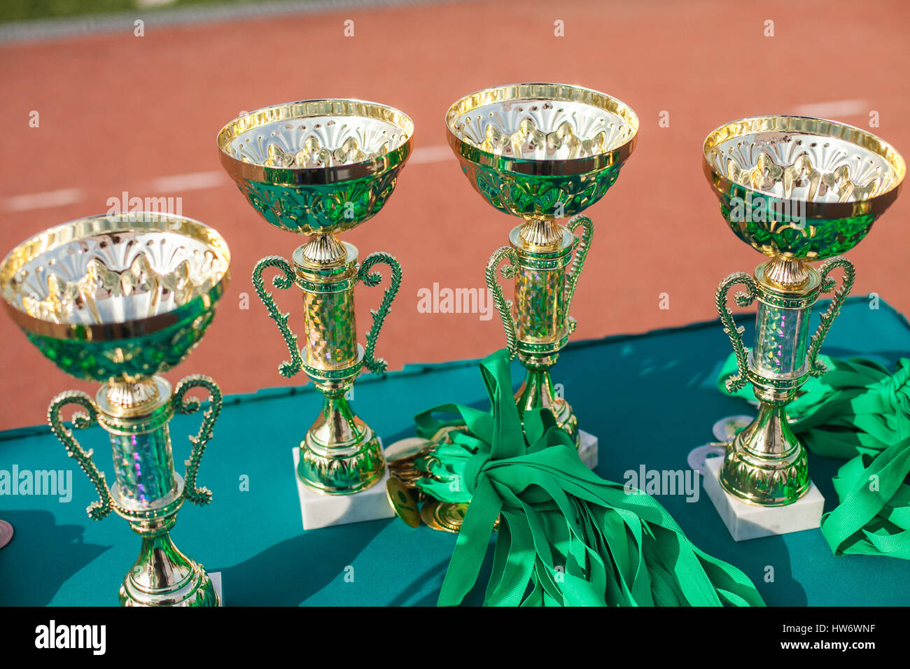 Victorious cups in sports meets Stock Photo - Alamy
