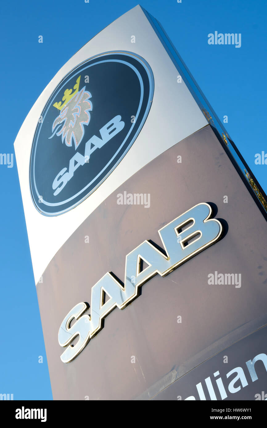 Saab dealership sign against blue sky Stock Photo - Alamy