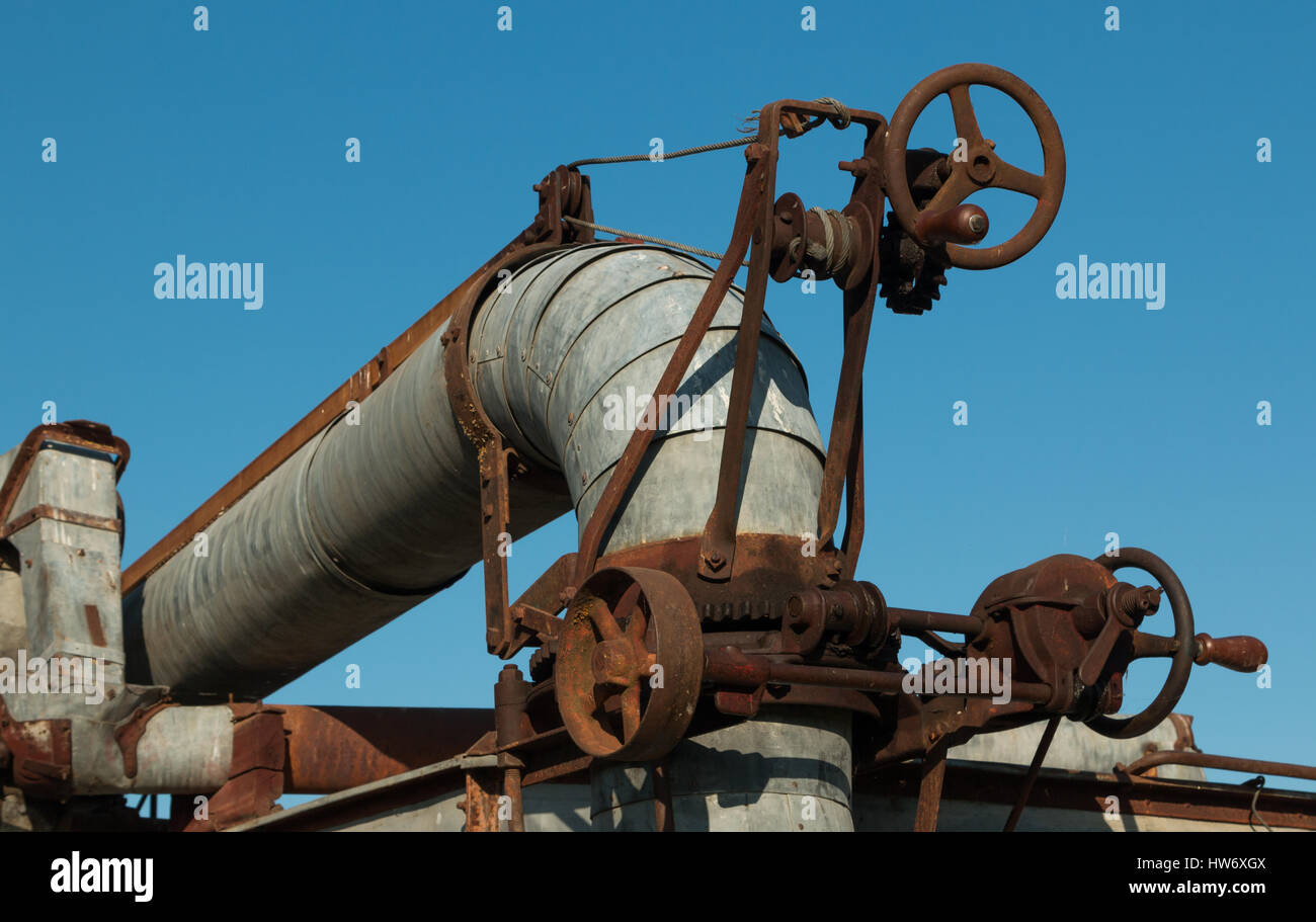 Main feed pipe or tube on a old harvester Stock Photo - Alamy