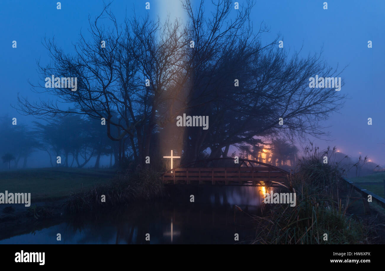 Beam of heavenly light beaming down on a white cross on a bridge Stock ...