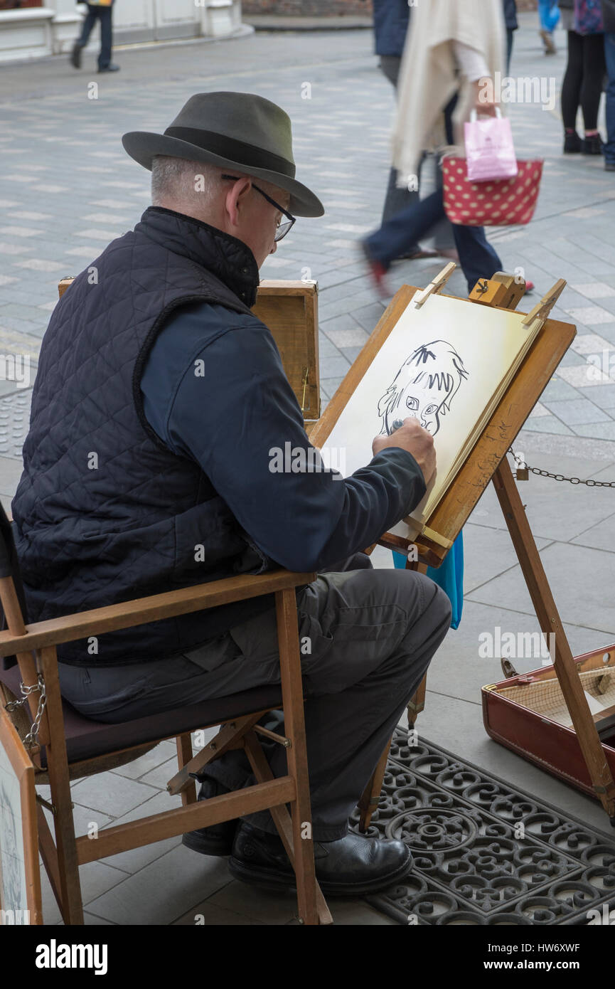 Street artist drawing caricature hi-res stock photography and images ...